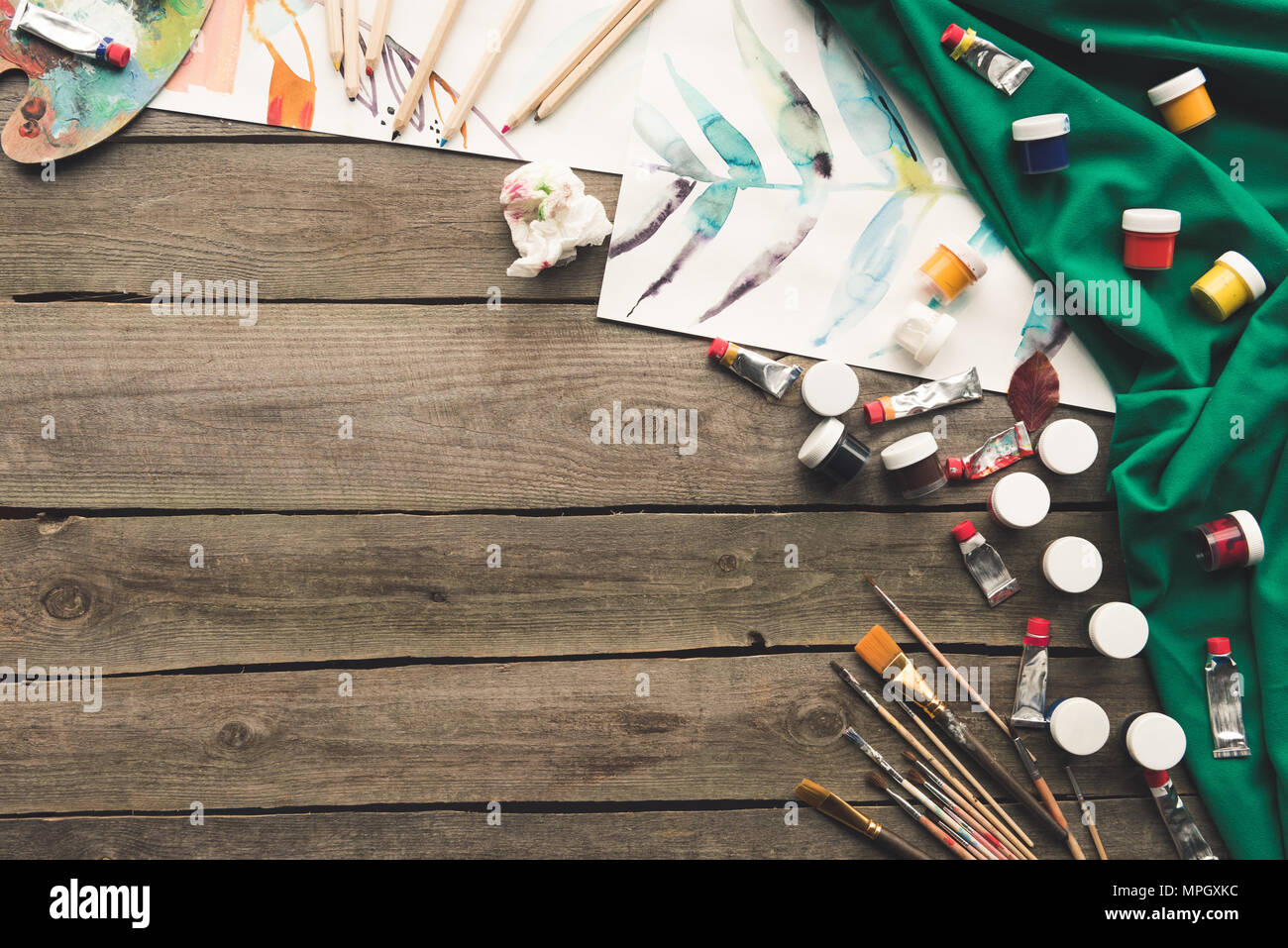 scattered different paint and sketches Stock Photo - Alamy