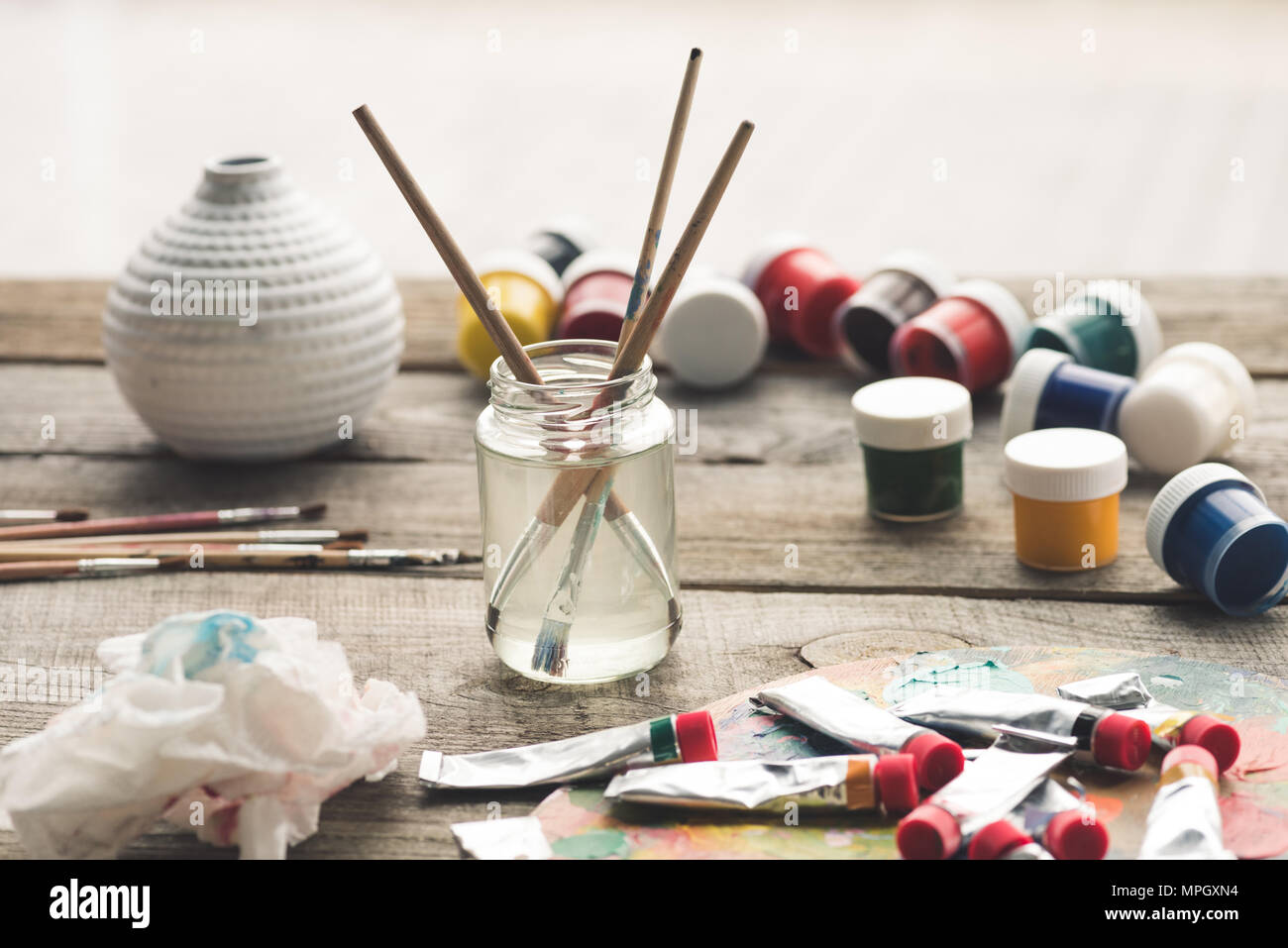 Paint brushes in solvent Stock Photo - Alamy
