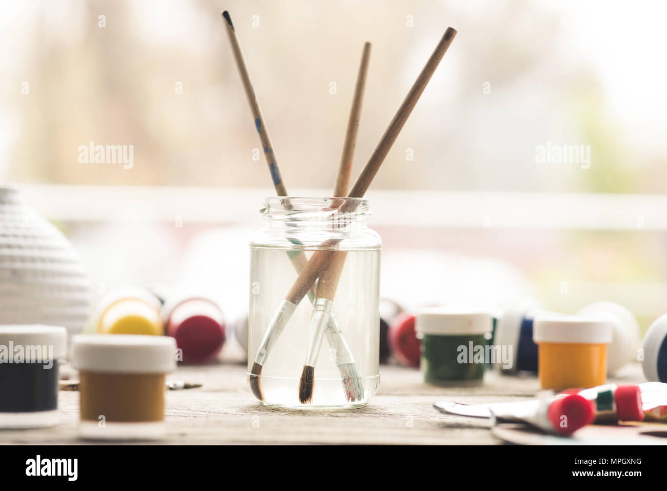 Paint brushes in solvent Stock Photo - Alamy