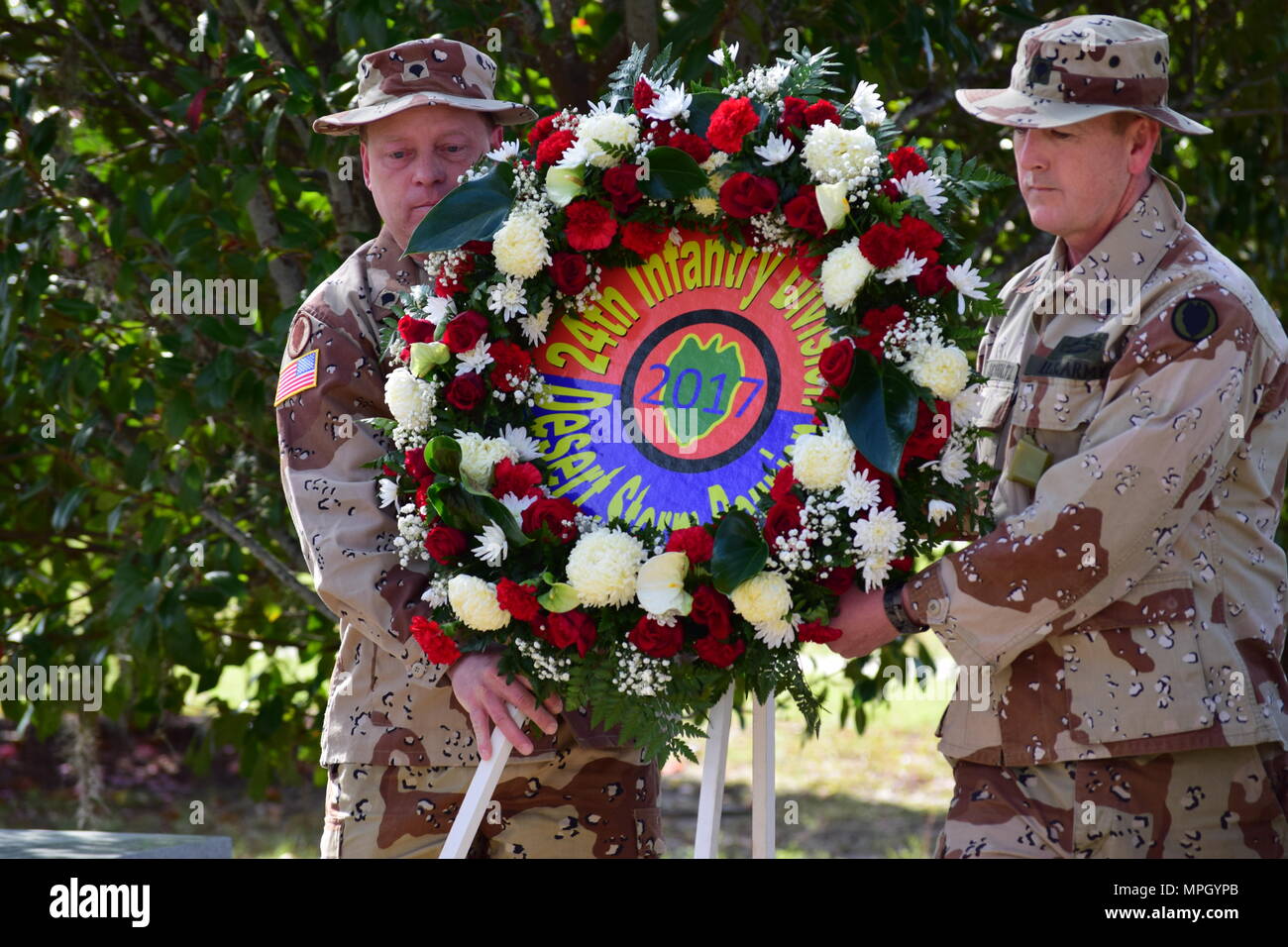 24th Infantry Division Veteran wreath-bearers present the wreath to the ...