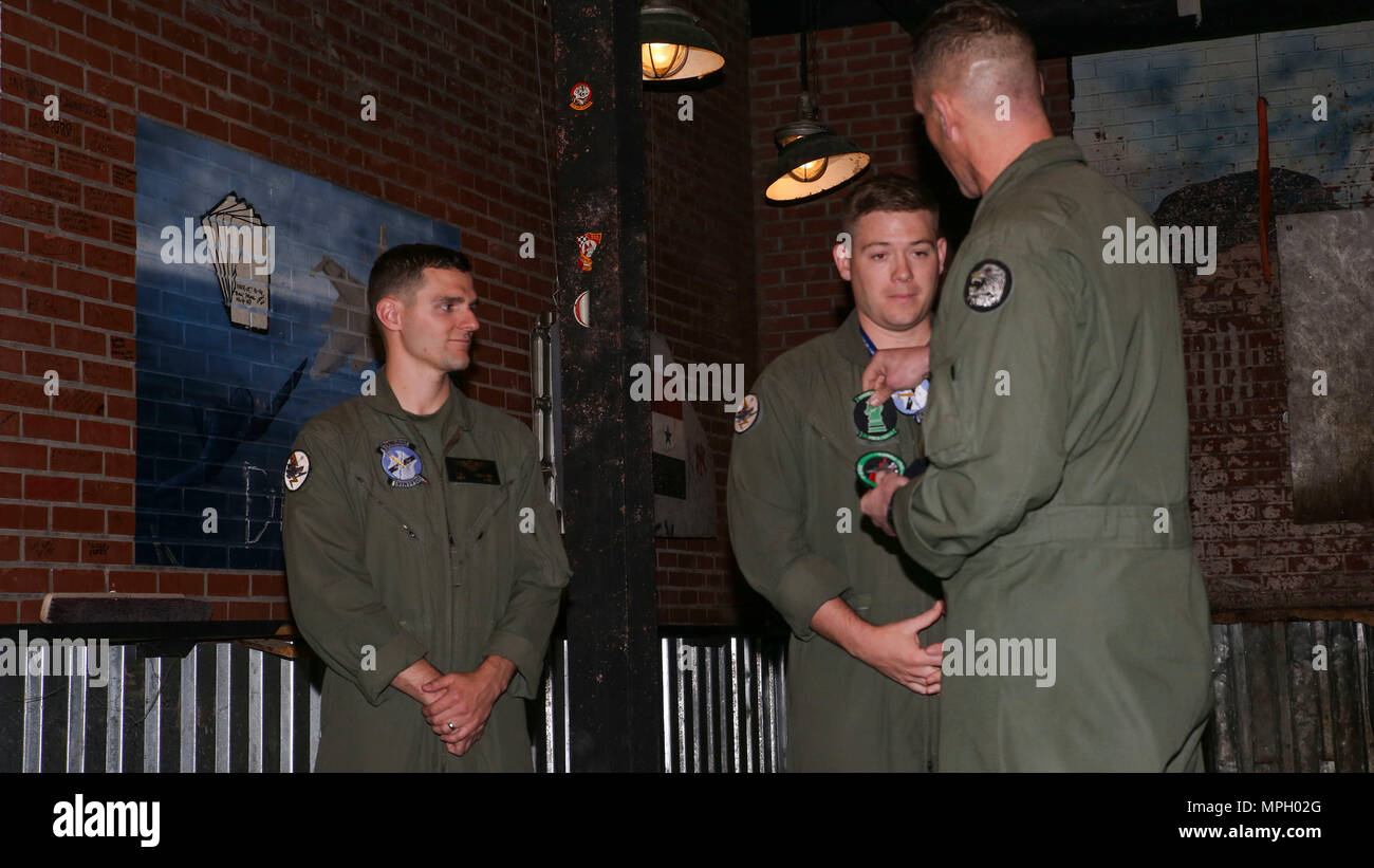 Lieutenant Colonel Gregory J. Summa, right, gives patches to Capt ...