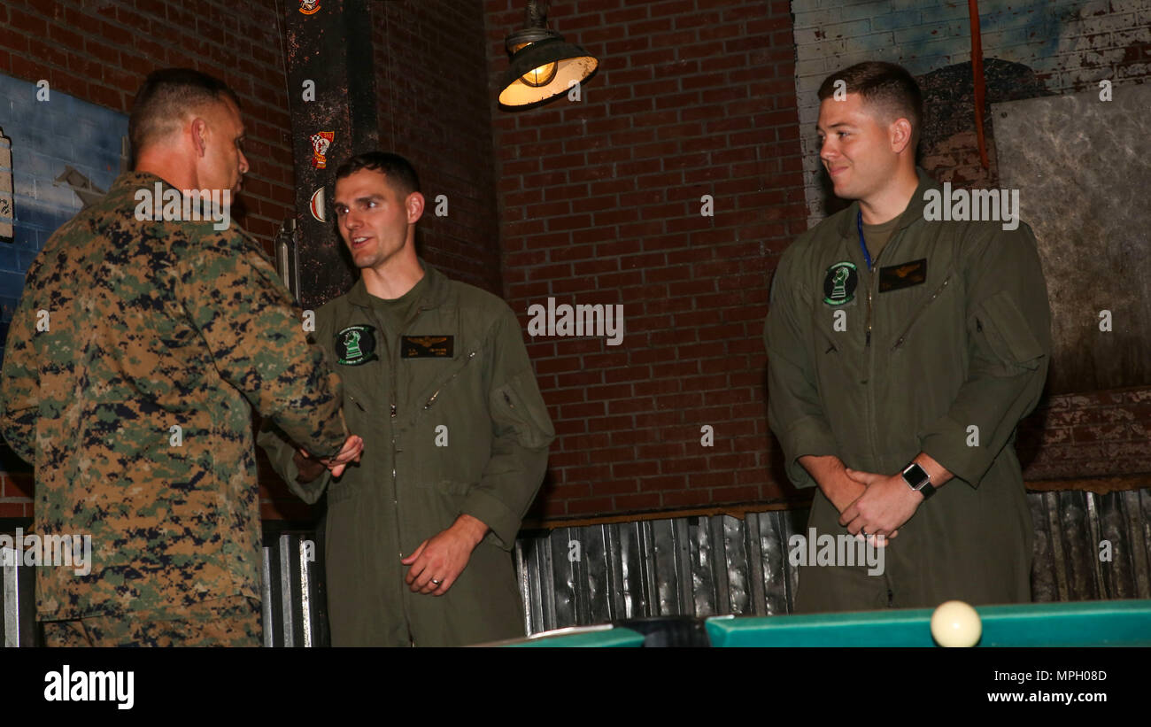 Brig. Gen. Matthew Glavy, left, presents Capt. Taylor Zehrung and Capt ...