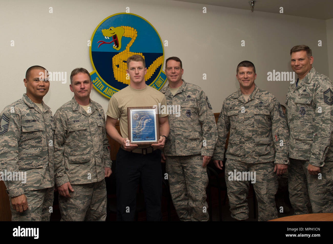 Airman 1st Class Derek J. King, a 311th Aircraft Maintenance Unit crew ...