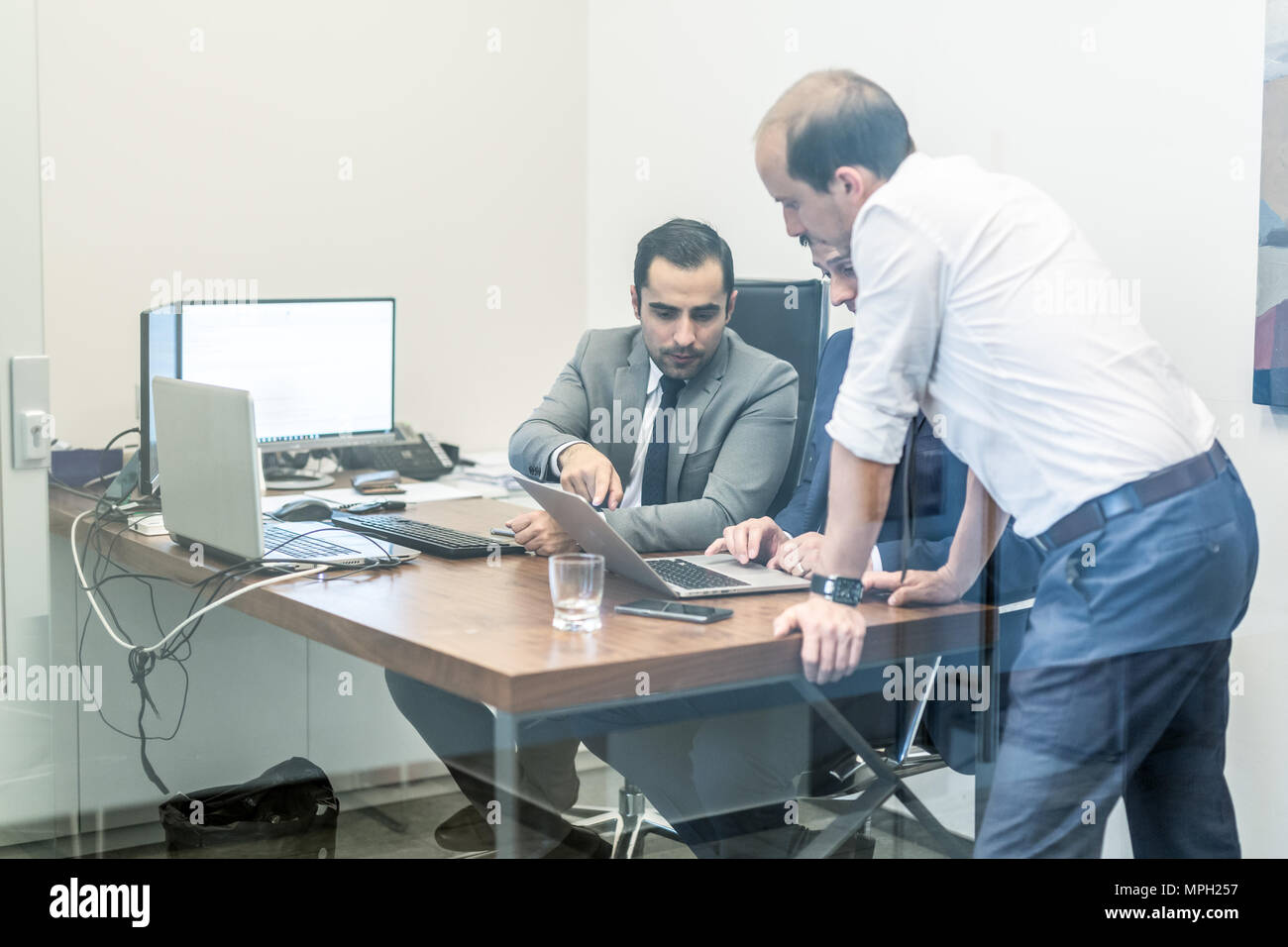 Cheerful corporate business people work in modern office. Project ...