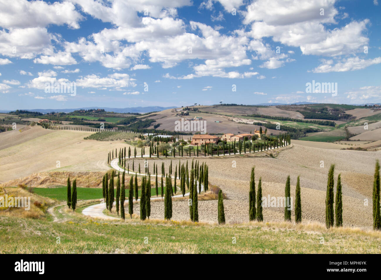Val d'Orcia, October 2017:Tuscan landscape with hill, house and cypress ...