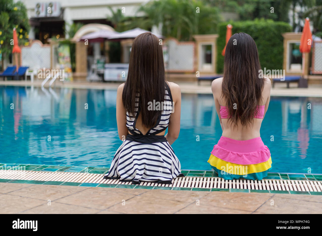 Two young woman swimming hi-res stock photography and images - Alamy
