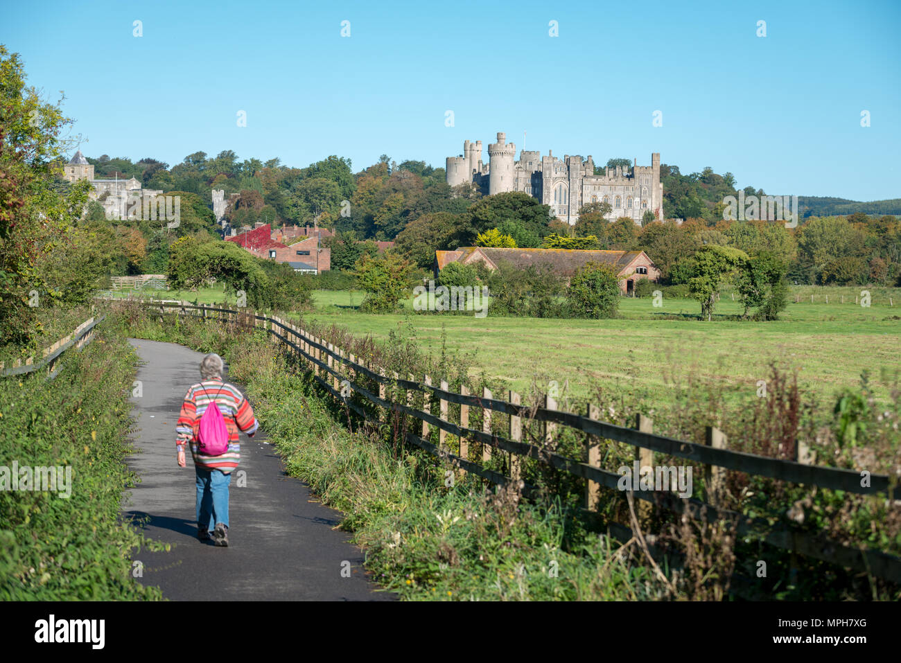 A woman walks along a footpath near Arundel Castle in Arundel, West ...