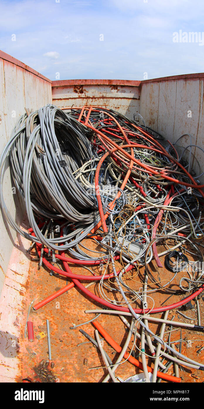 Many electric cables in the dump container Stock Photo - Alamy