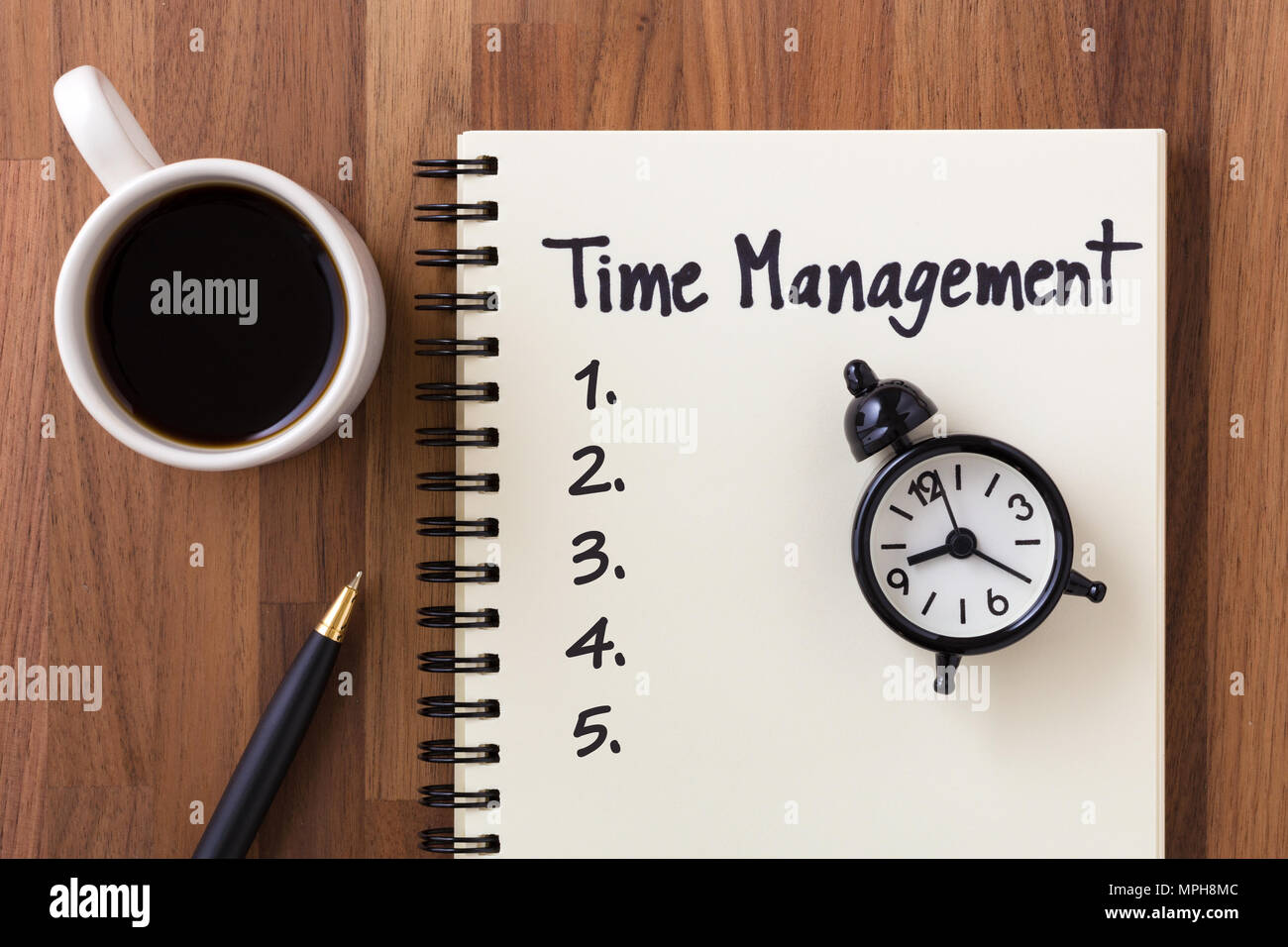Time management concept with list on notebook, clock and coffee cup ...