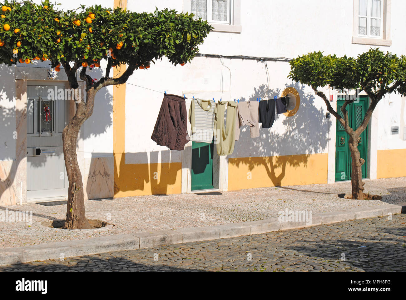 Laundry on clothesline between houses hi-res stock photography and ...