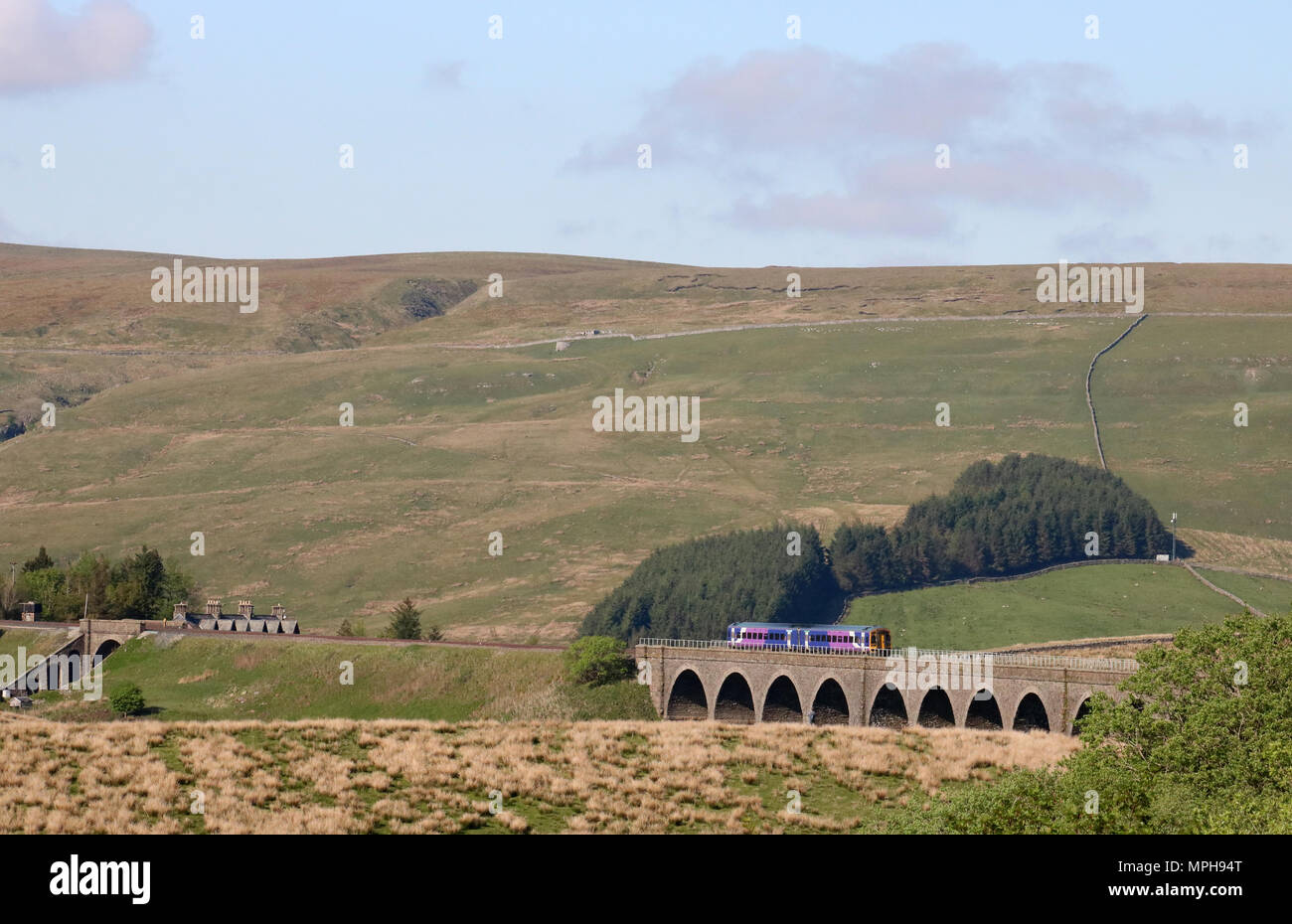 Class 158 Express Sprinter dmu with a passenger train on the Settle to ...