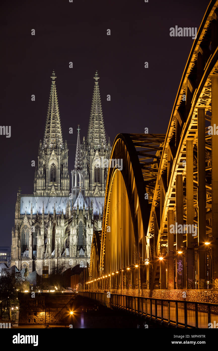 Cologne Hohenzollern bridge in front of cathedral at night Stock Photo ...