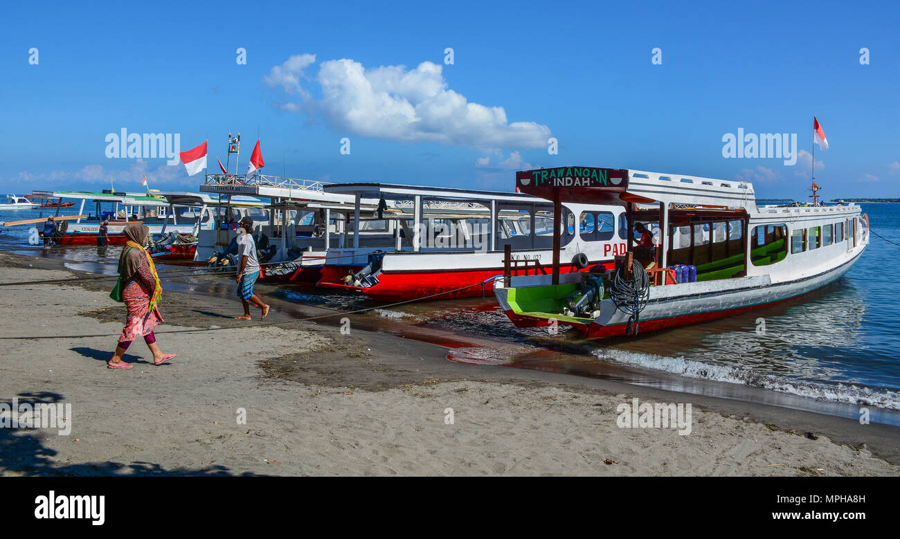 Bali, Indonesia - Apr 17, 2016. Passengers coming to the ferry at tourist pier in Bali Island ...
