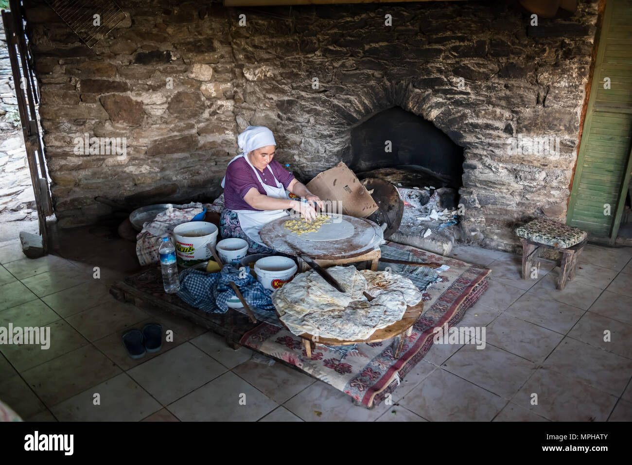 Unidentified woman Cooks traditional Turkish food Gozleme(pastries ...