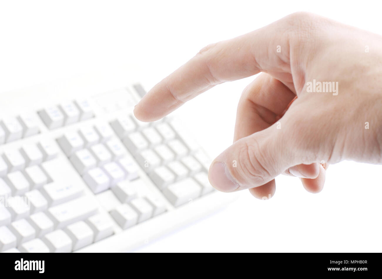 finger hit the button on the old computer keyboard Stock Photo - Alamy