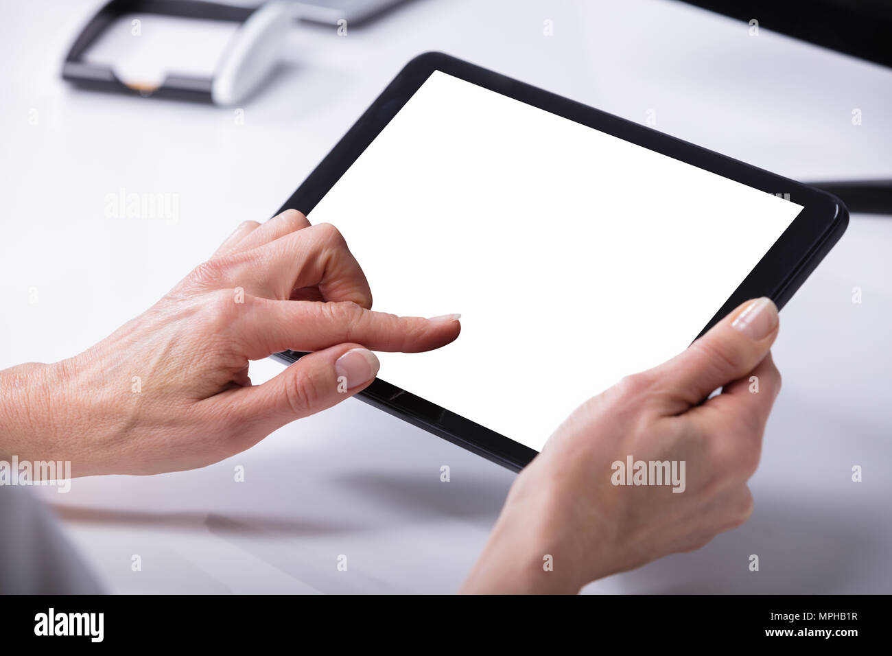 Female hand using blank hi-res stock photography and images - Alamy