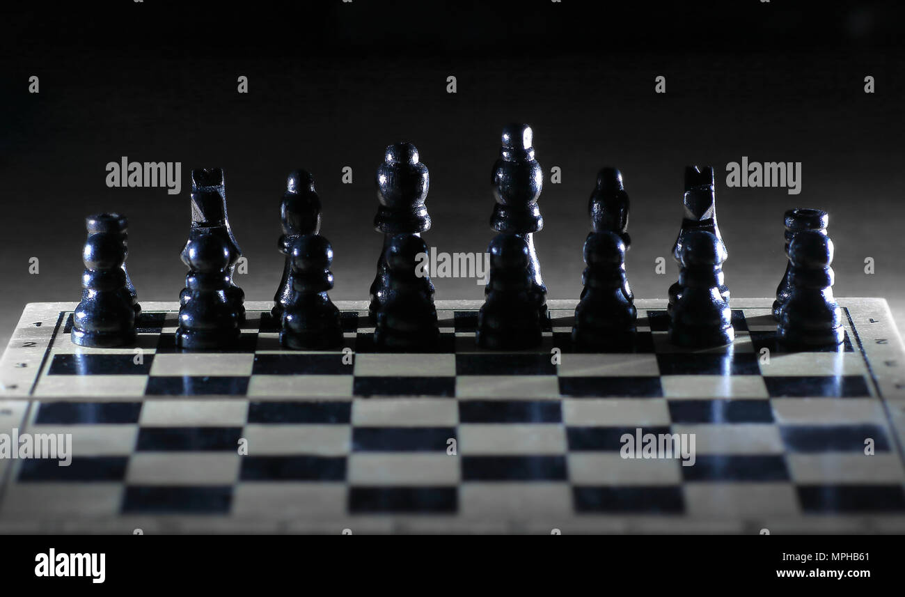 black chess pieces on the game Board.strategy concept Stock Photo - Alamy