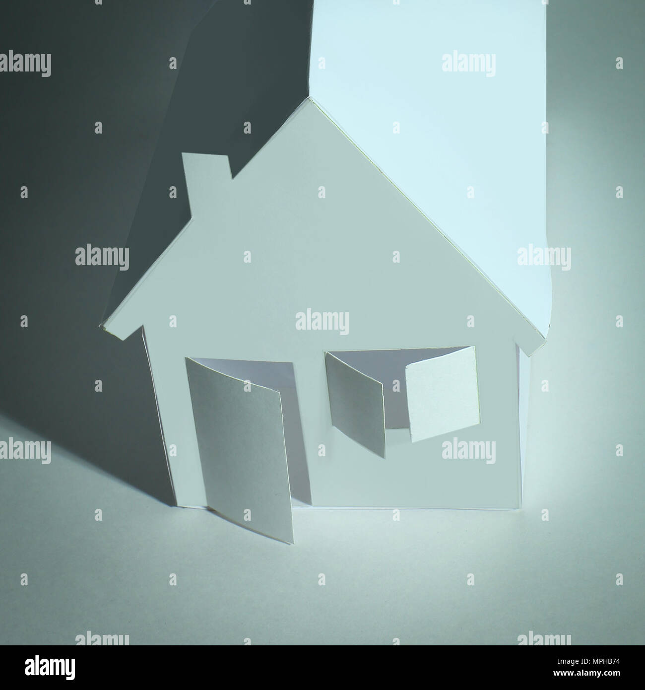 paper house paper background.the concept of a mortgage Stock Photo - Alamy