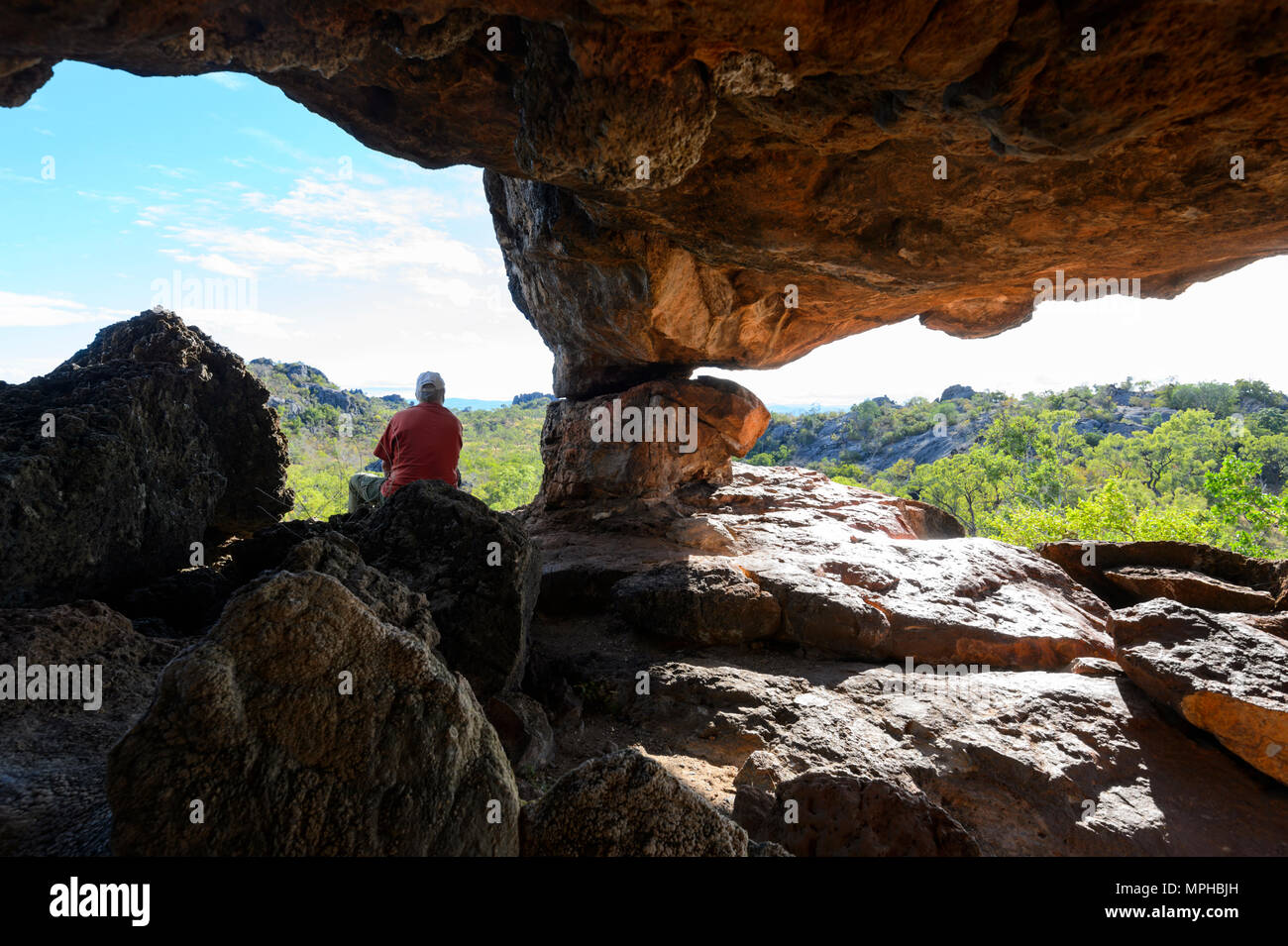 Visitor at an eroded limestone outcrop in Chillagoe-Mungana Caves ...