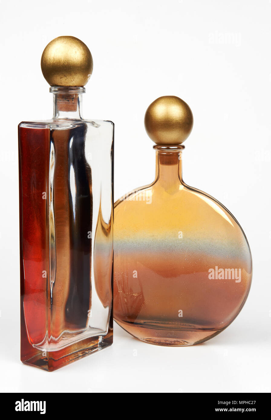 two colored bottles in white background Stock Photo - Alamy
