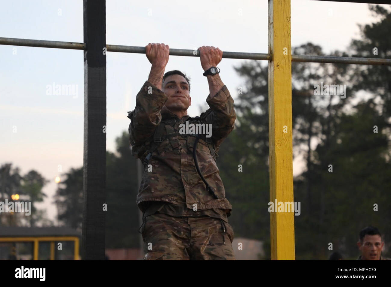 A U.S. Army Ranger performs pull-ups on Malvesti during The 35th Annual ...