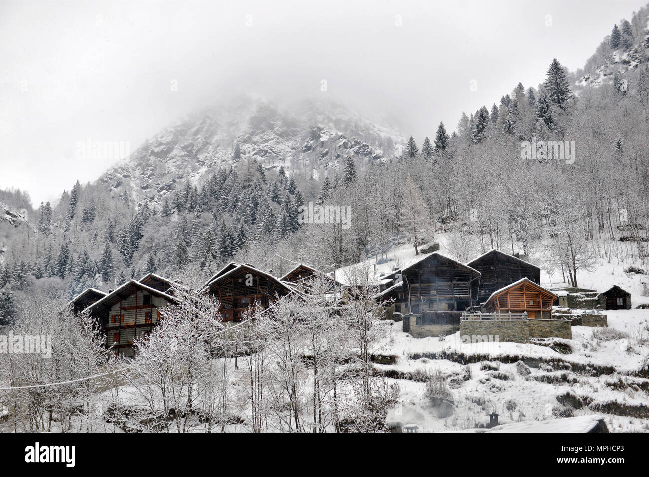 winter landscape in the Alps with the river and clouds Stock Photo - Alamy