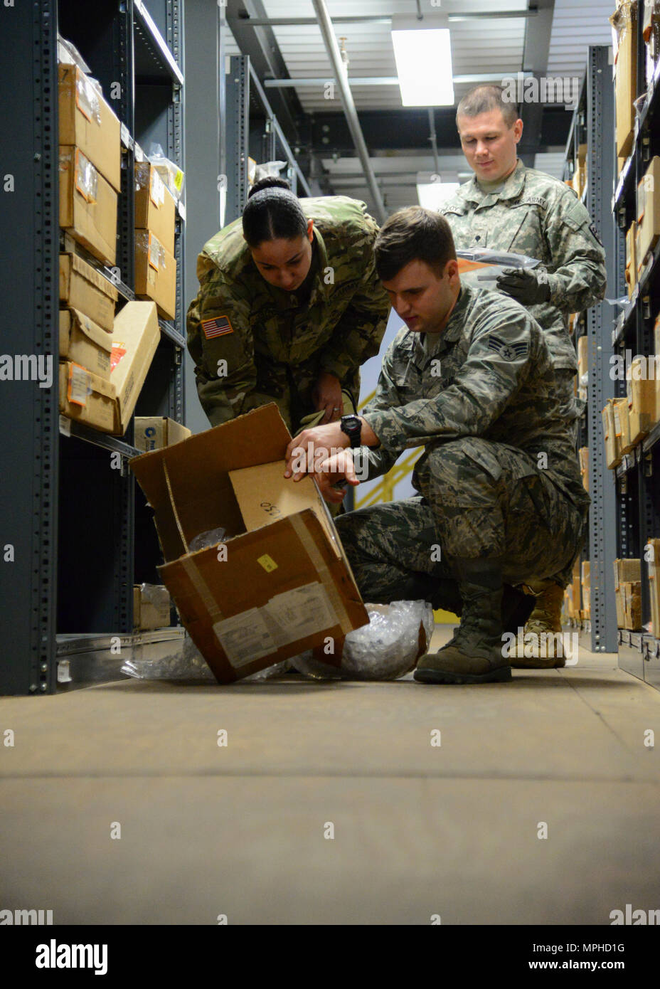 Two U.S. Army Soldiers train with a U.S. Air Force Airmen to learn how ...