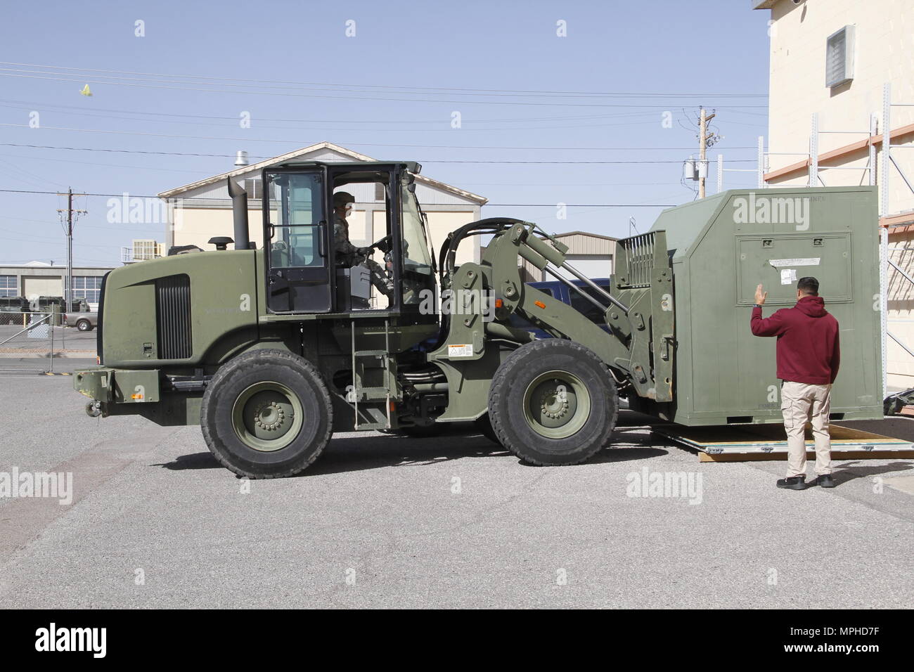 Tech. Sgt. Christopher Hammack moves gear at the Desert Defenders ...