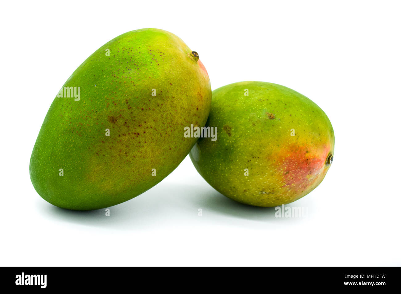Two mangos isolated on white background, mango fruit green Stock Photo ...