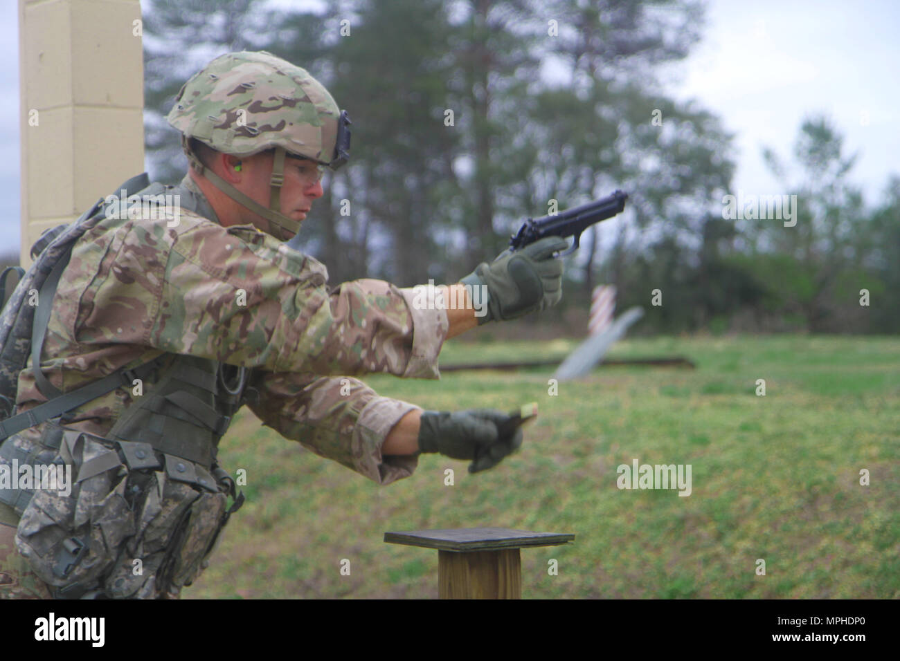 A Best Warrior Competitor changes out magazine during weapons skills ...