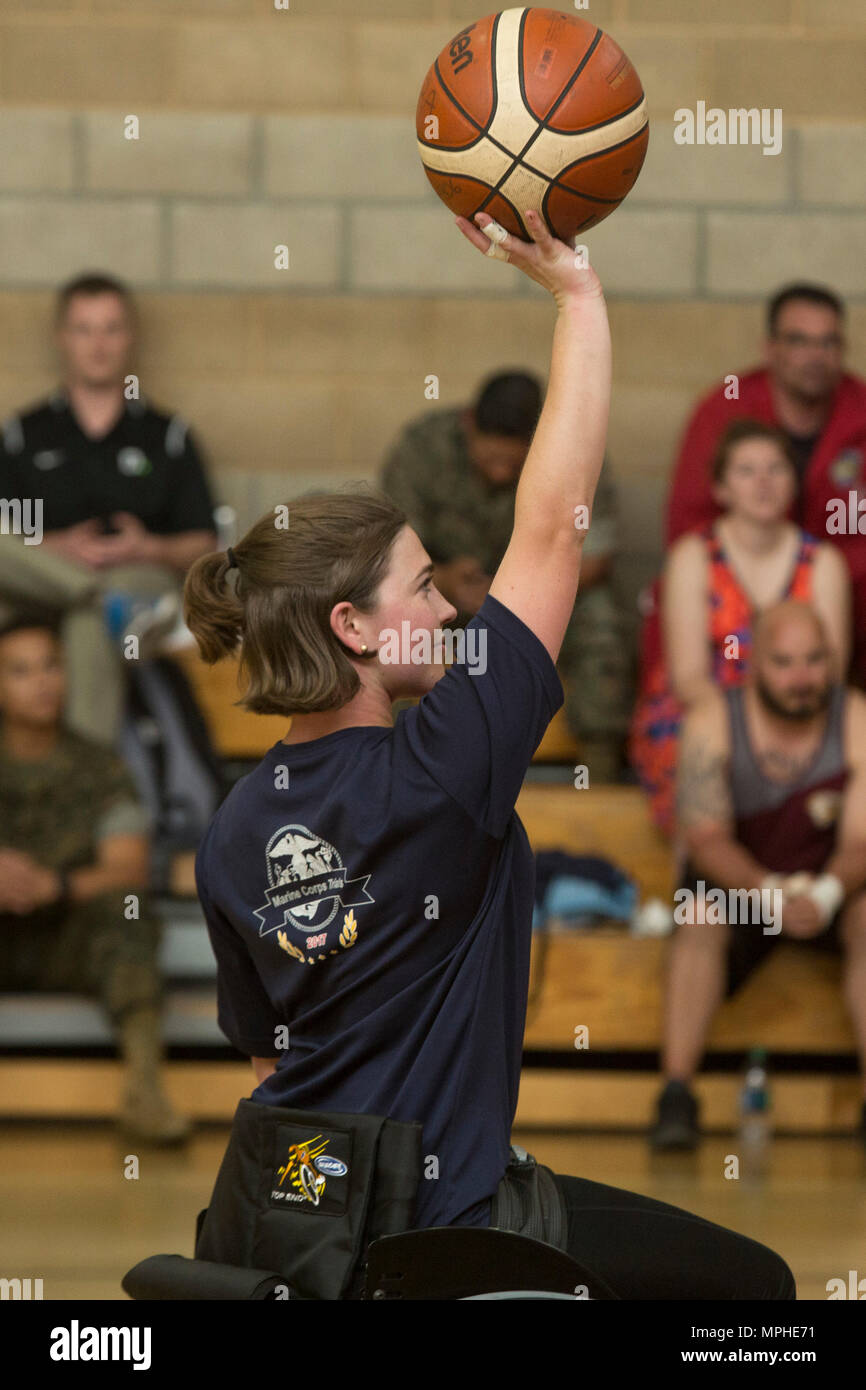 U.S. Marine Corps Cpl. Rachel Wakefield prepares to shoot the ball ...
