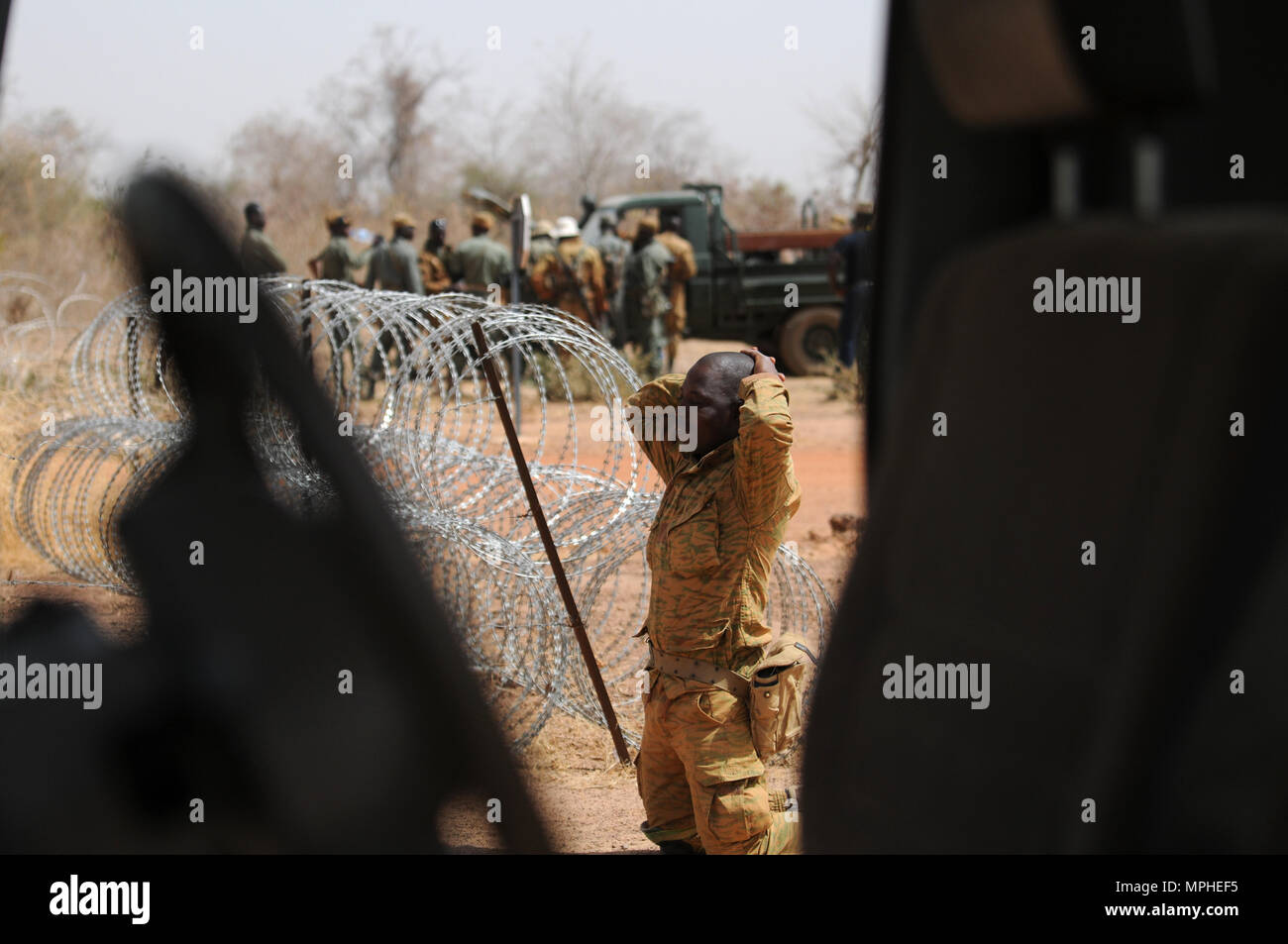 Burkina Faso Soldiers practice detaining people during entry control ...