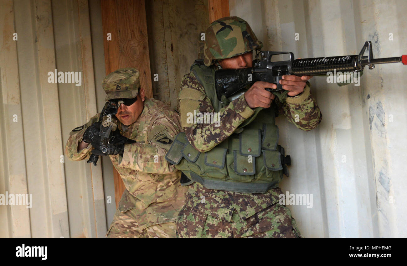 A U.S. Army adviser from Task Force Forge conducts a room clearing ...