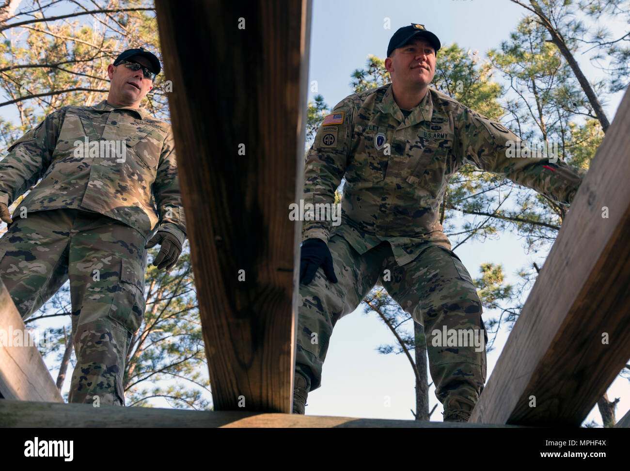 Command Sgt. Maj. Lawrence Ogle (Left) and Army Staff Sgt. Adam Whitley ...