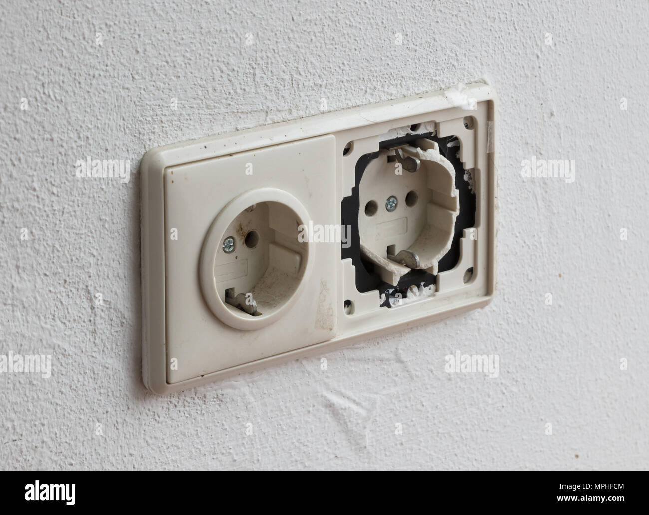 Broken electricity socket hi-res stock photography and images - Alamy