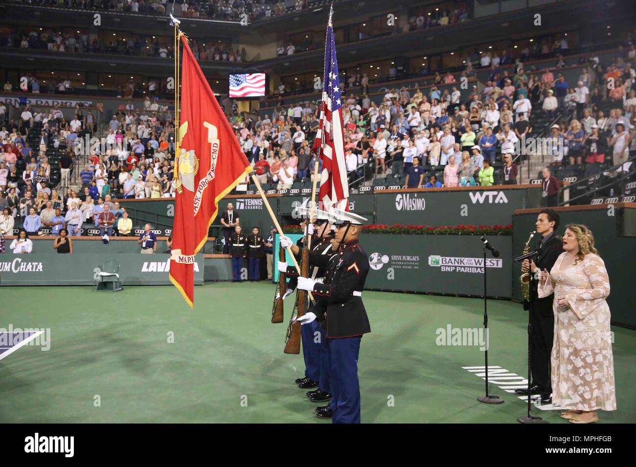 The Headquarters Battalion Color Guard presents the national and Marine ...