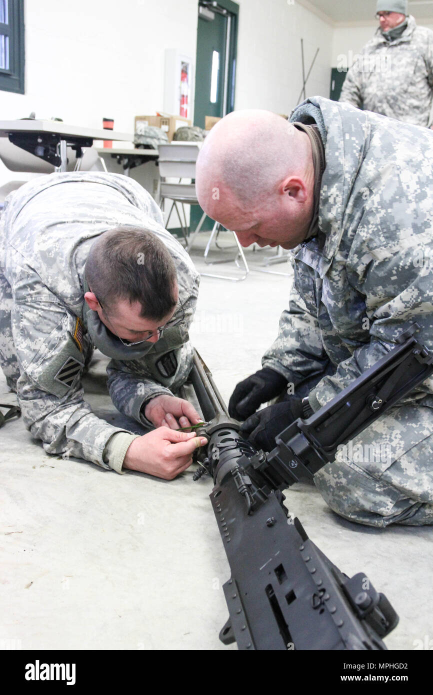 FORT MCCOY, Wis. - U.S. Amy Reserve Sgt. Gereld Moore (left) and Spc ...