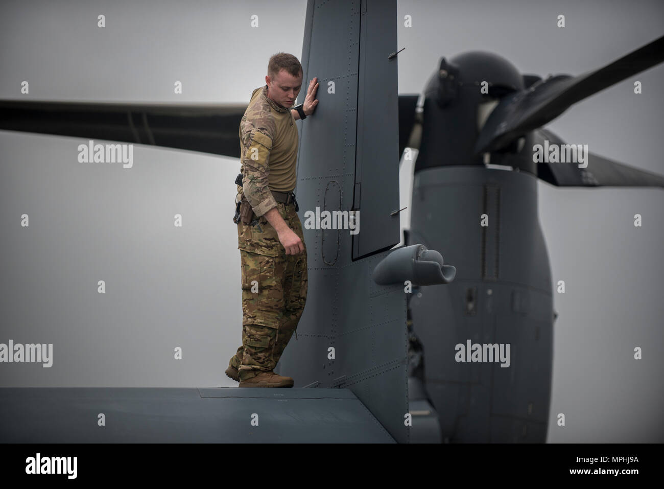 A flight engineer with the 8th Special Operations Squadron runs pre ...