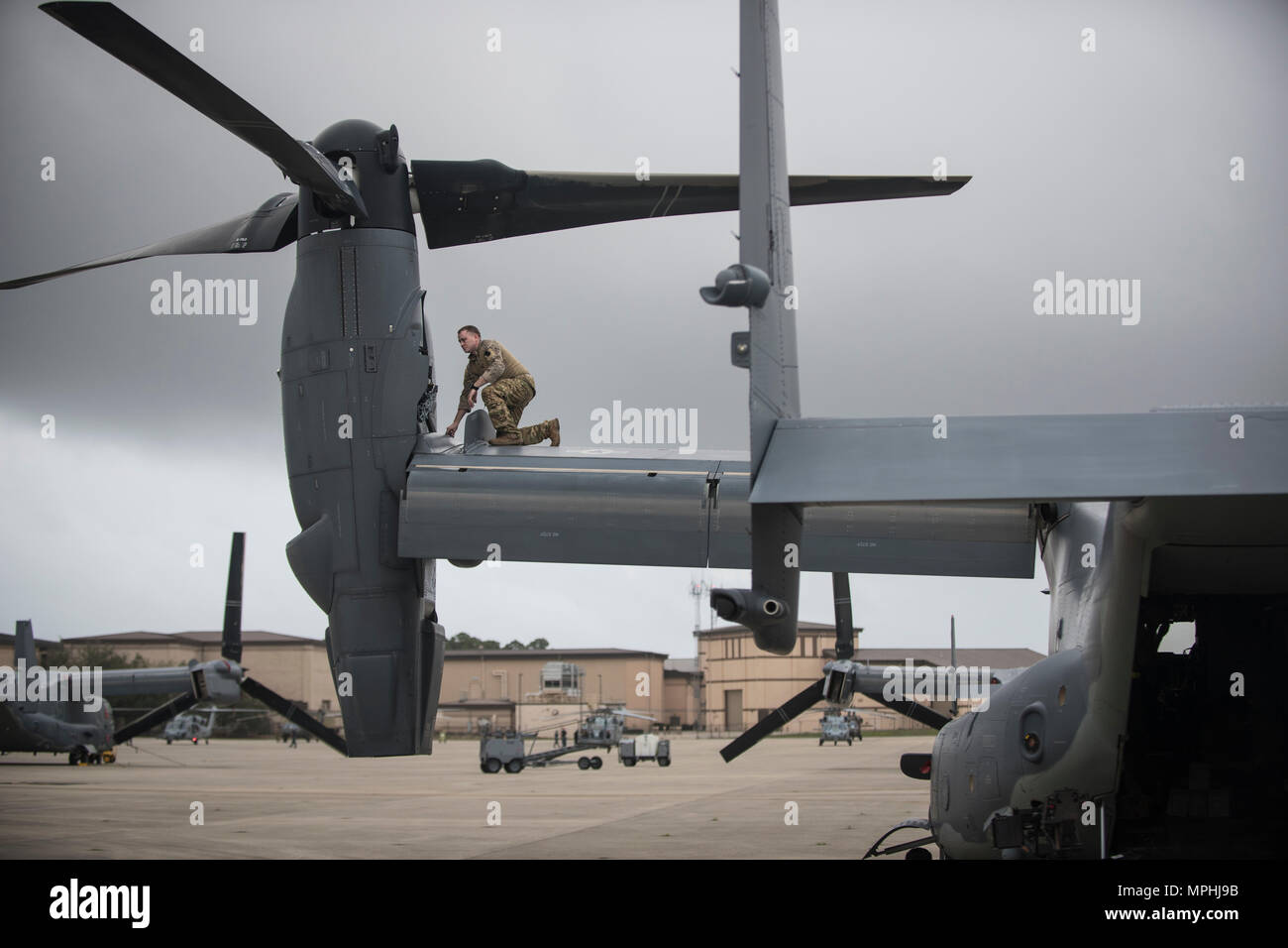 A flight engineer with the 8th Special Operations Squadron runs pre ...