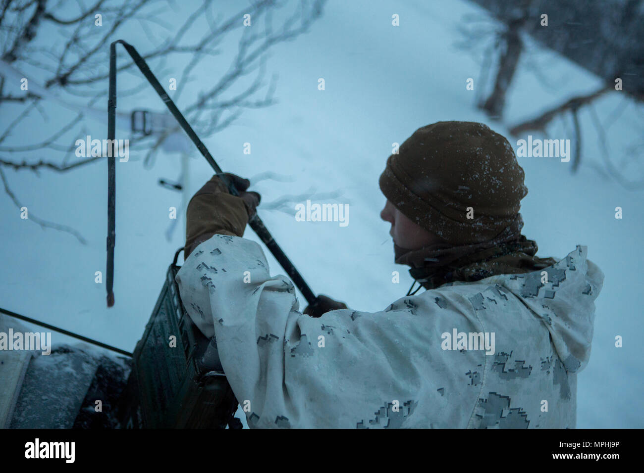 U.S. Marine Corps Lance Cpl. Christopher Wasilewski sets up a 117-F ...
