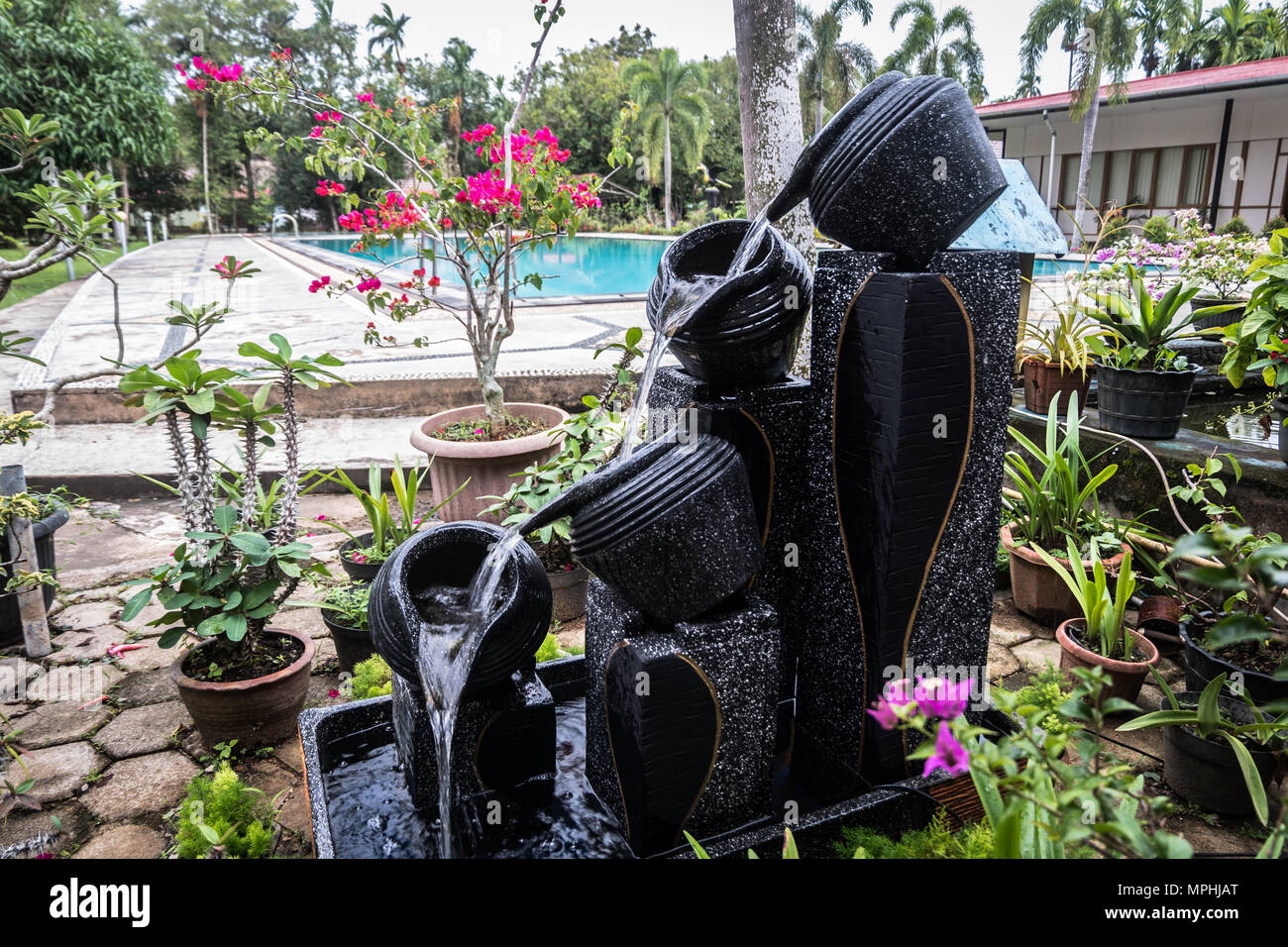 Pot of flowing water at the gardenn Stock Photo - Alamy