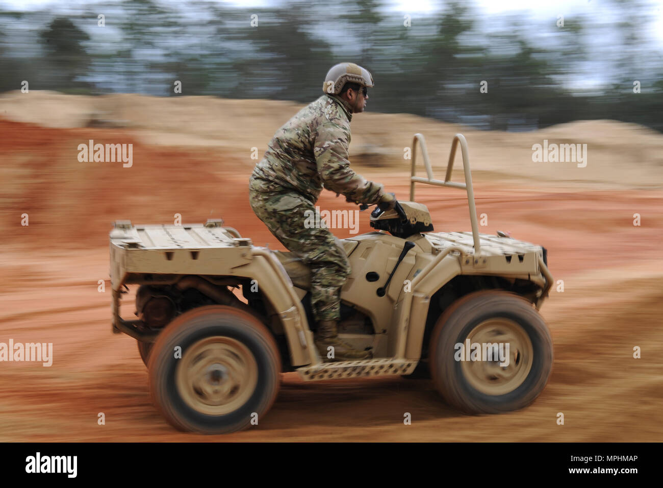 A Soldier with the 1st Battalion, 10th Special Forces Group, rides an ...
