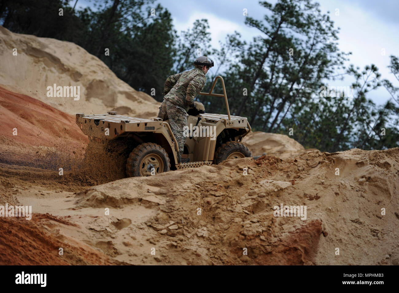 A Soldier with the 1st Battalion, 10th Special Forces Group, rides an ...