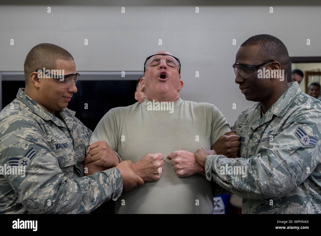 Col. Kenneth Moss, 374th Airlift Wing commander, reacts to getting ...