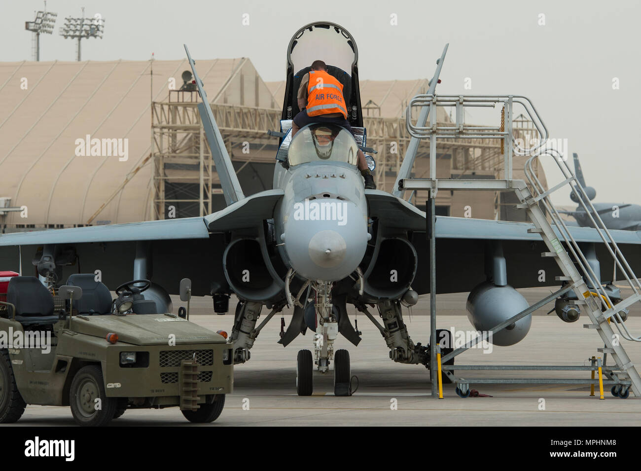 A Royal Australian Air Force maintainer prepares an F-18 F/A Hornet for ...