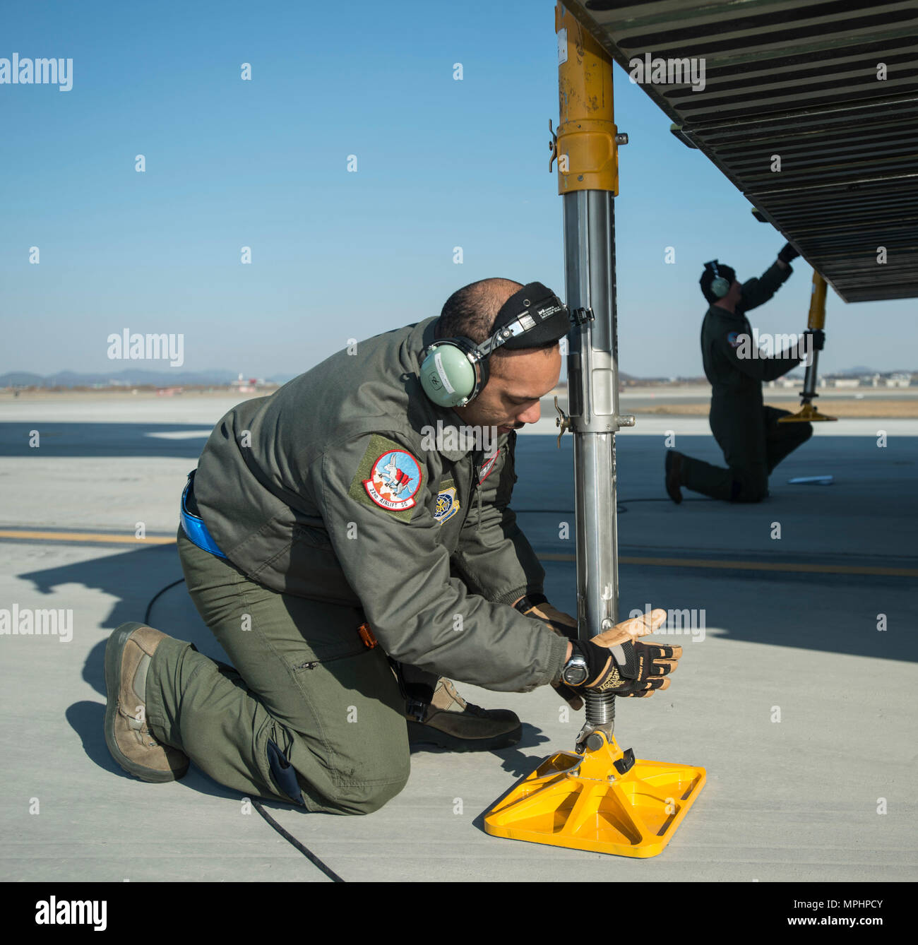 Staff Sgt. Jarryd Morgan, left, and Staff Sgt. Matthew Larson, assigned ...