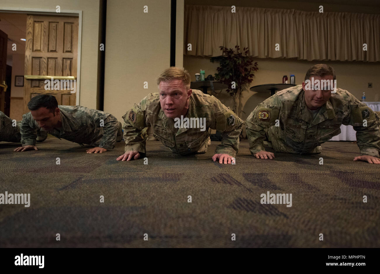 Airmen from the 38th Rescue Squadron perform ceremonial push-ups, March ...