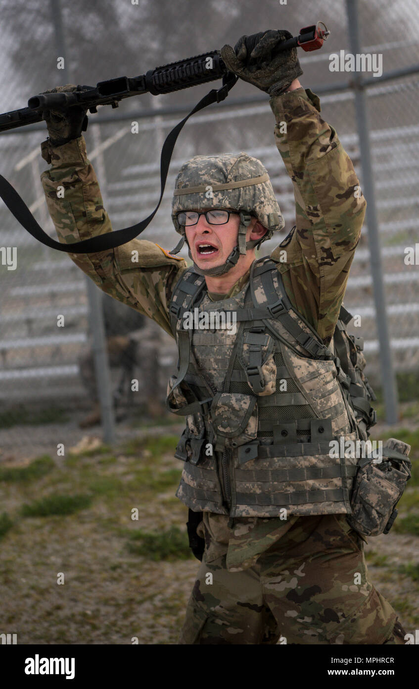 Pfc. Seth Horton from the 300th Military Police Brigade, holds his ...