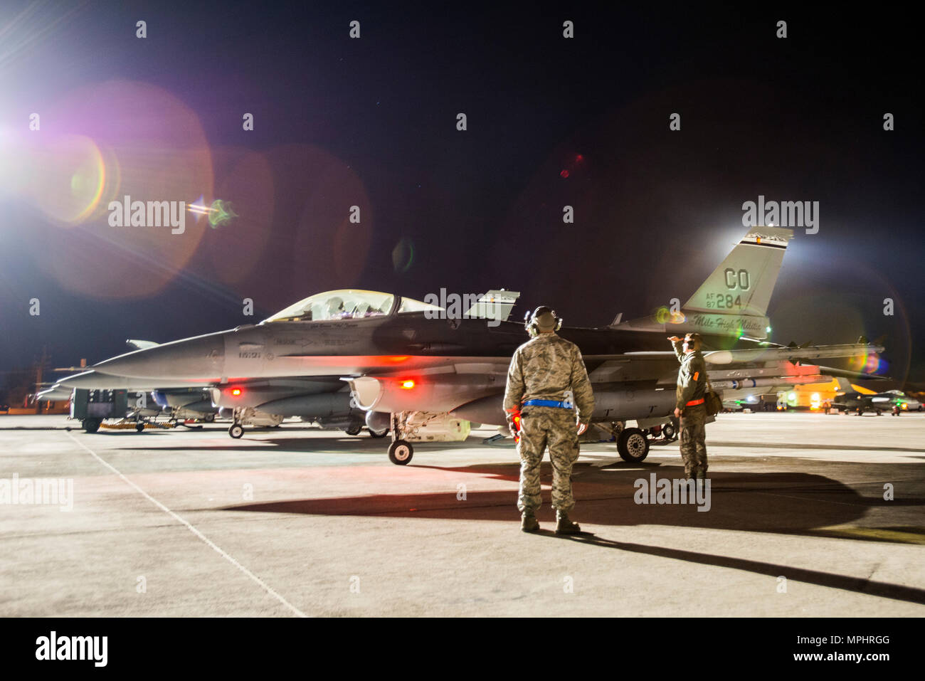 Tech. Sgt. James Grevious, a crew chief (left) and Senior Airman Ryan ...