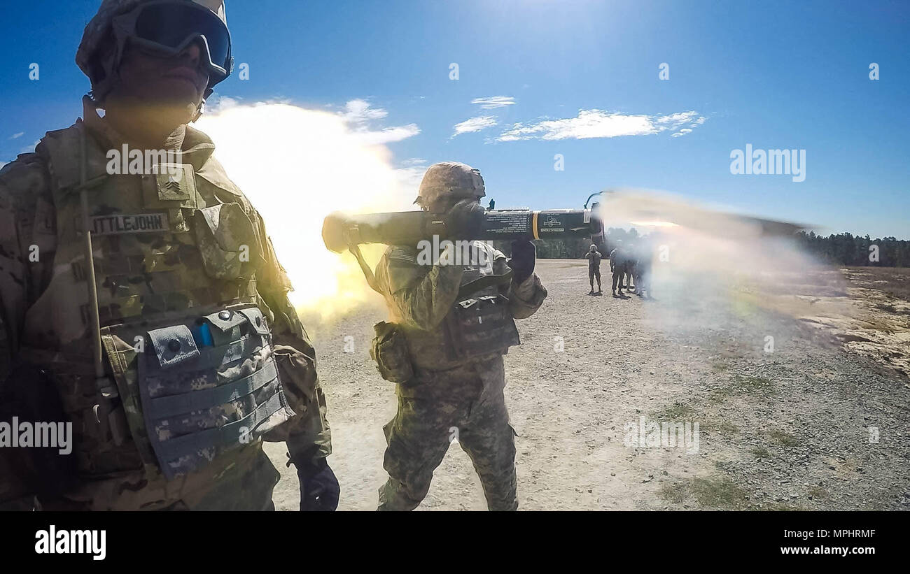 Back blast from a M136 AT4 rocket launcher create a heat wave as a ...